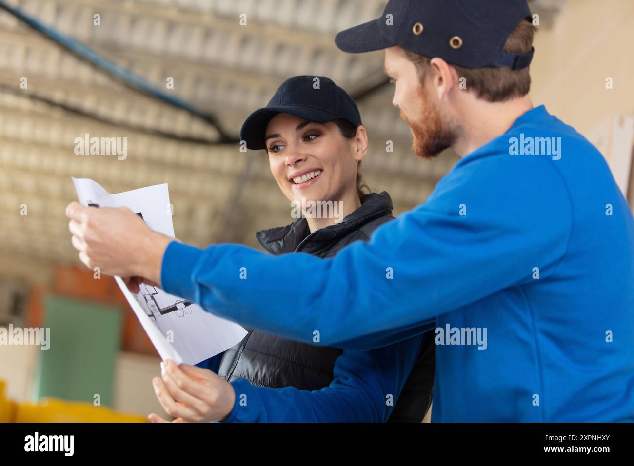 Working team male female builders hi-res stock photography and images ...