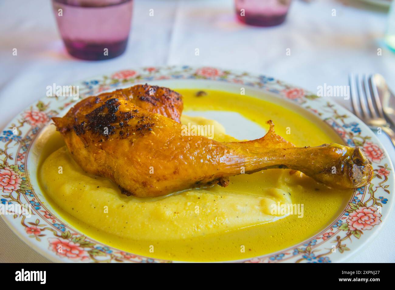 Roast chicken with potato puree and curry sauce Stock Photo - Alamy