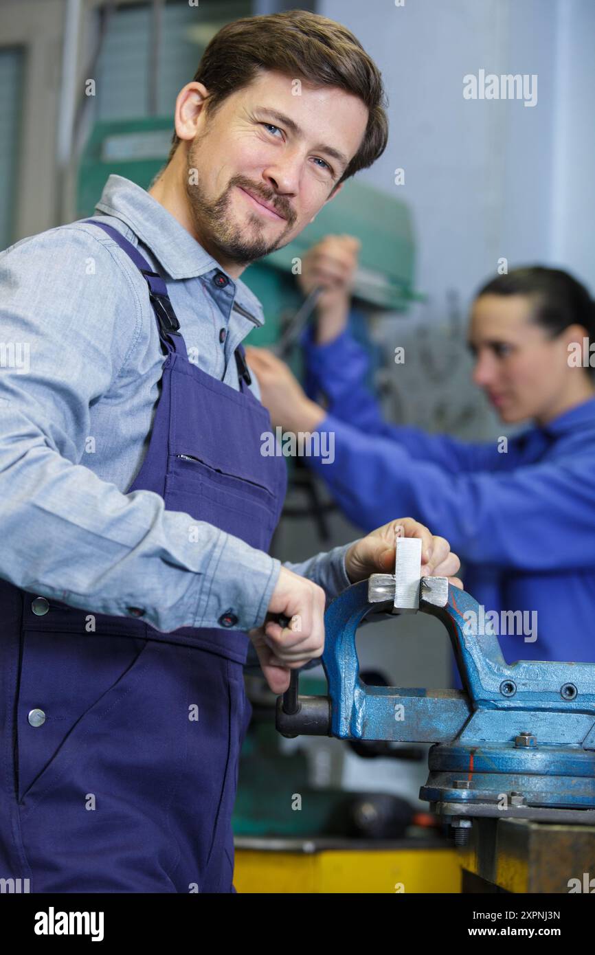 portrait of male engineer using vice Stock Photo - Alamy