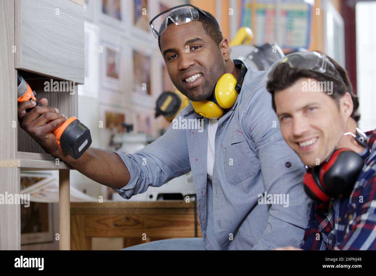 Mature carpenter holding drill hi-res stock photography and images - Alamy