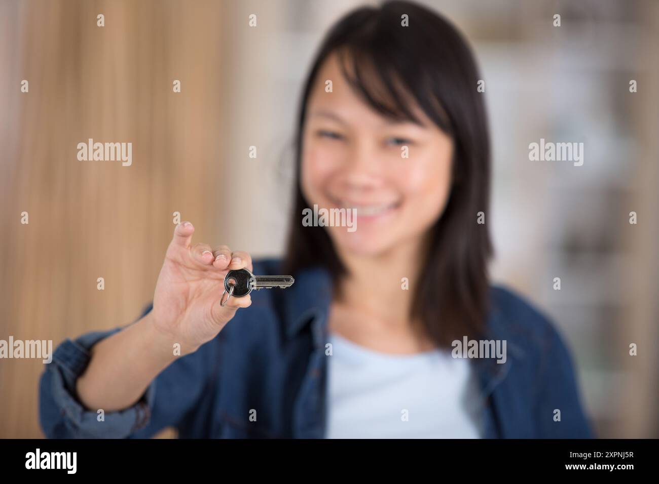 cute asian girl showing home residence keys Stock Photo - Alamy