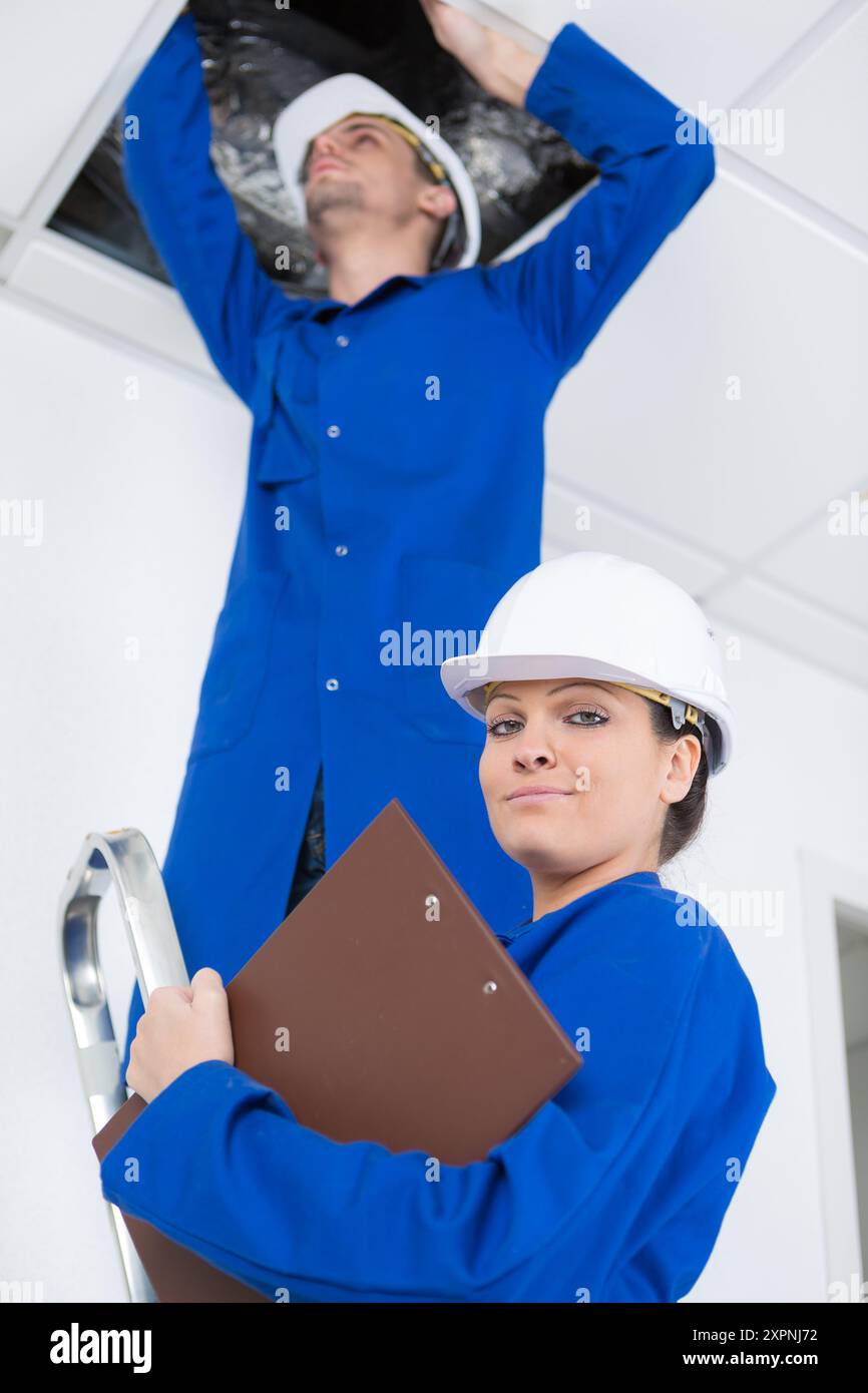 portrait of man inspecting the ceiling Stock Photo - Alamy