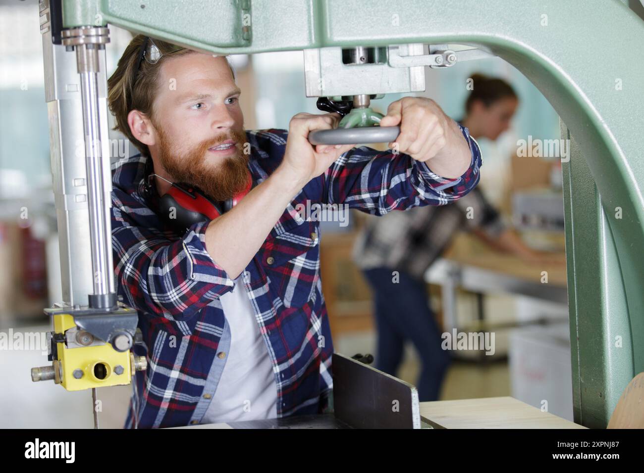 industrial factory worker turning valve Stock Photo - Alamy