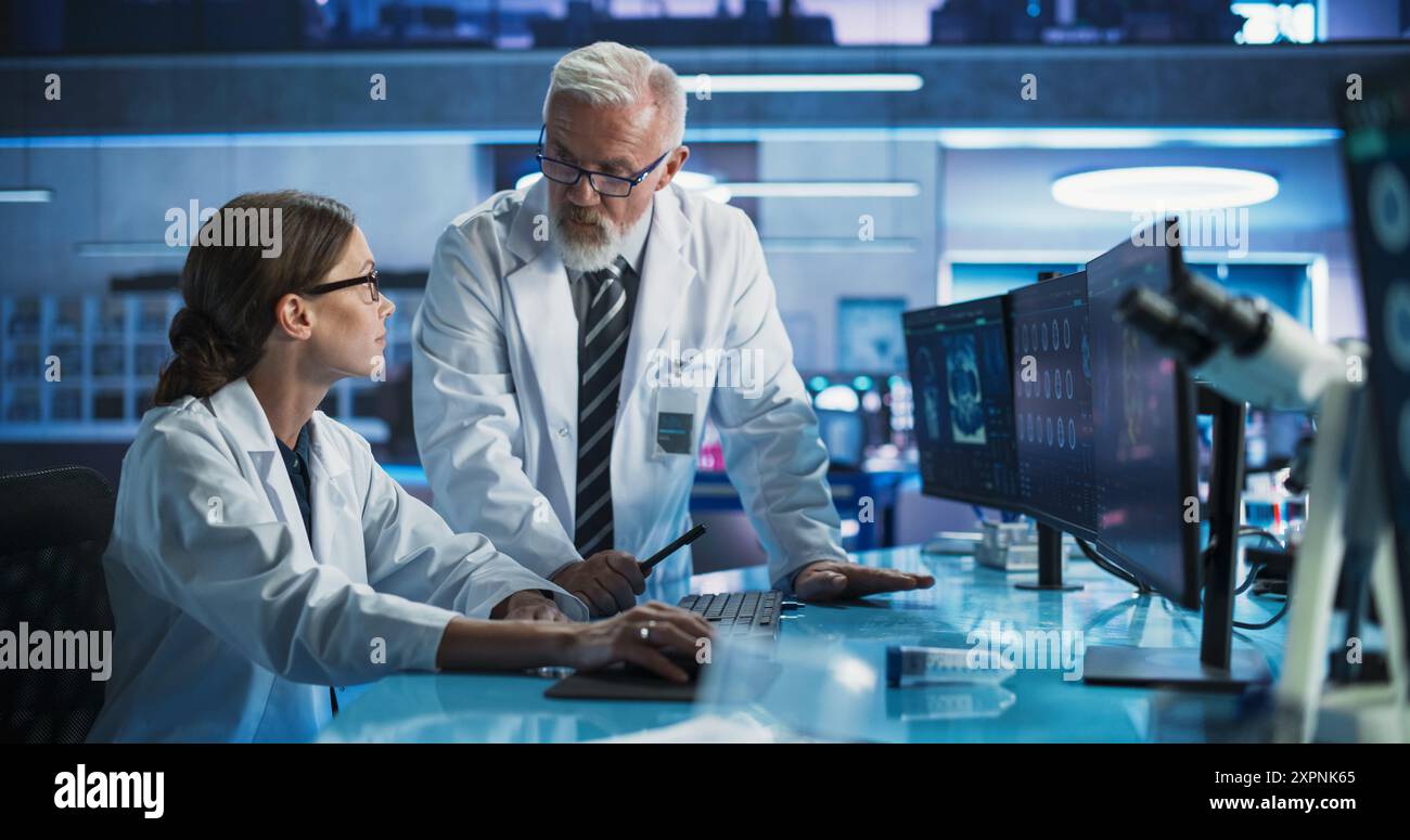 Biotechnology Research Laboratory: Two Caucasian Doctors Discussing CT ...