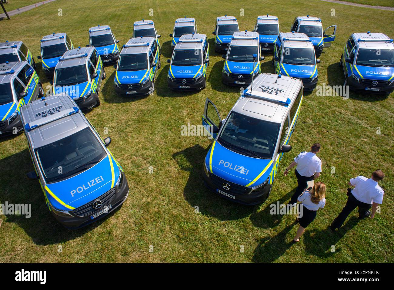 07 August 2024, Saxony-Anhalt, Magdeburg: Police vehicles stand side by ...