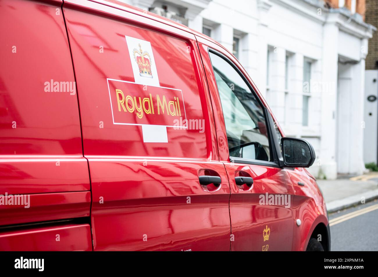 LONDON- JULY 23, 2024: Red Royal Mail van out on delivery in Chelsea ...