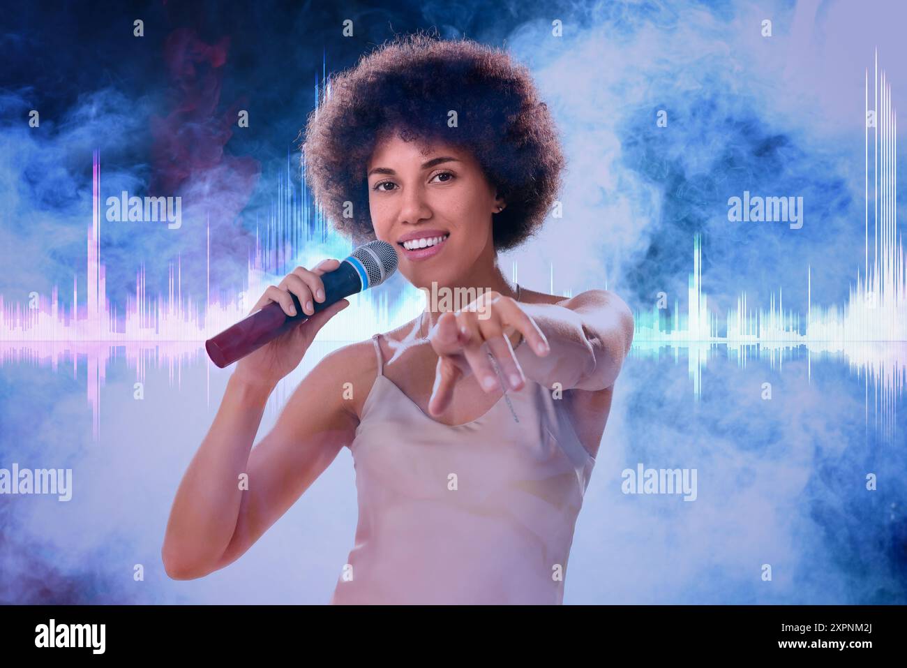 Curly young woman with microphone singing in smoke. Audio waveform near her Stock Photo - Alamy