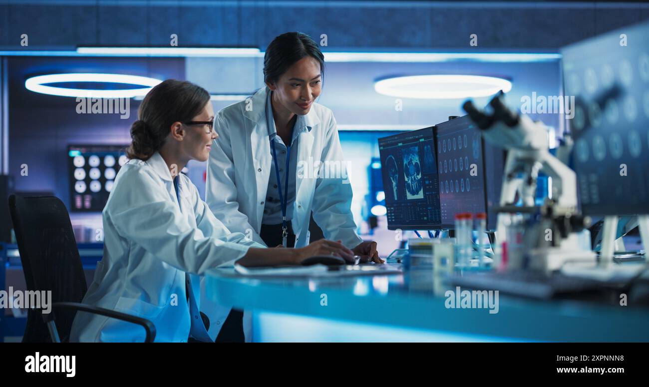 Asian And Caucasian Female Doctors Talking In Medical Research Center ...