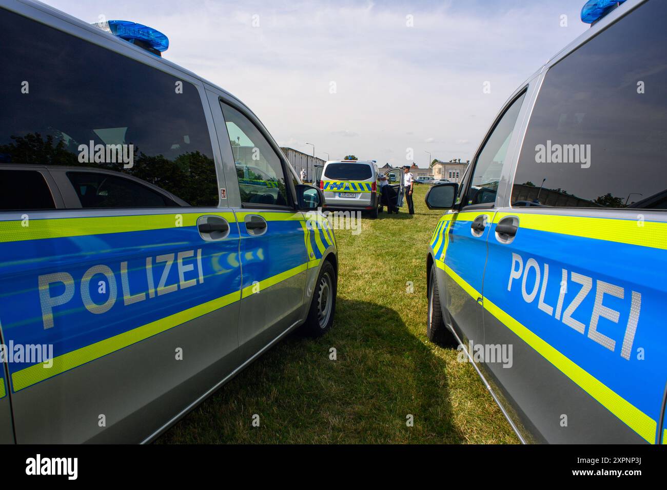 Magdeburg, Germany. 07th Aug, 2024. Police vehicles stand side by side ...