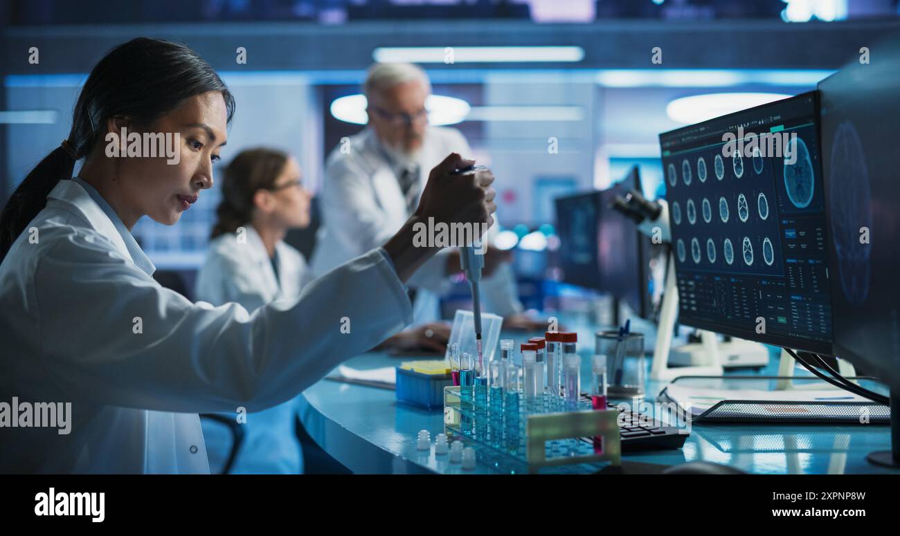 Biotechnology Research Laboratory: Female Asian Doctor Working With ...