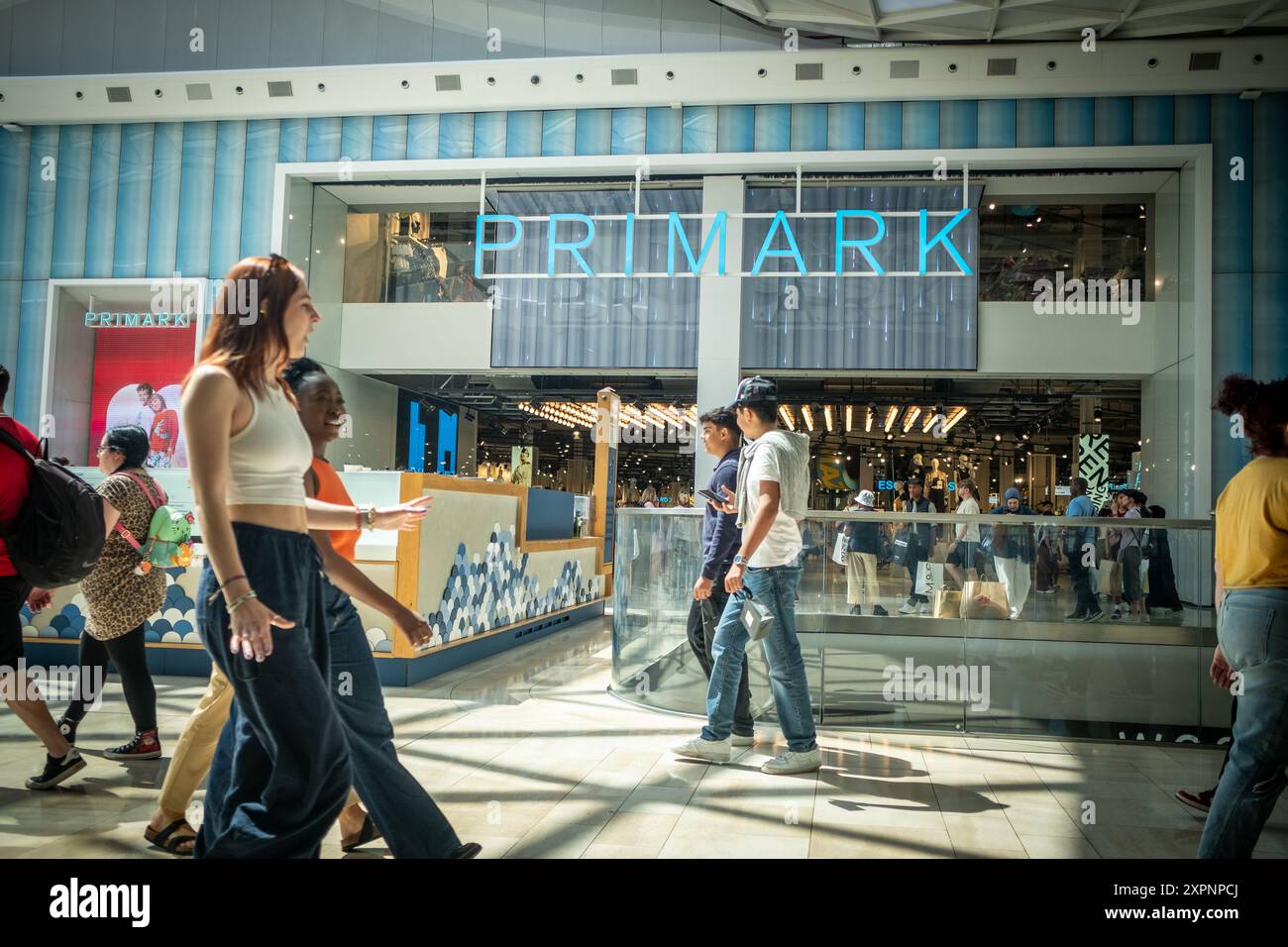 LONDON- JULY 29, 2024: Shoppers outside Primark branch in Westfield London shopping centre in ...