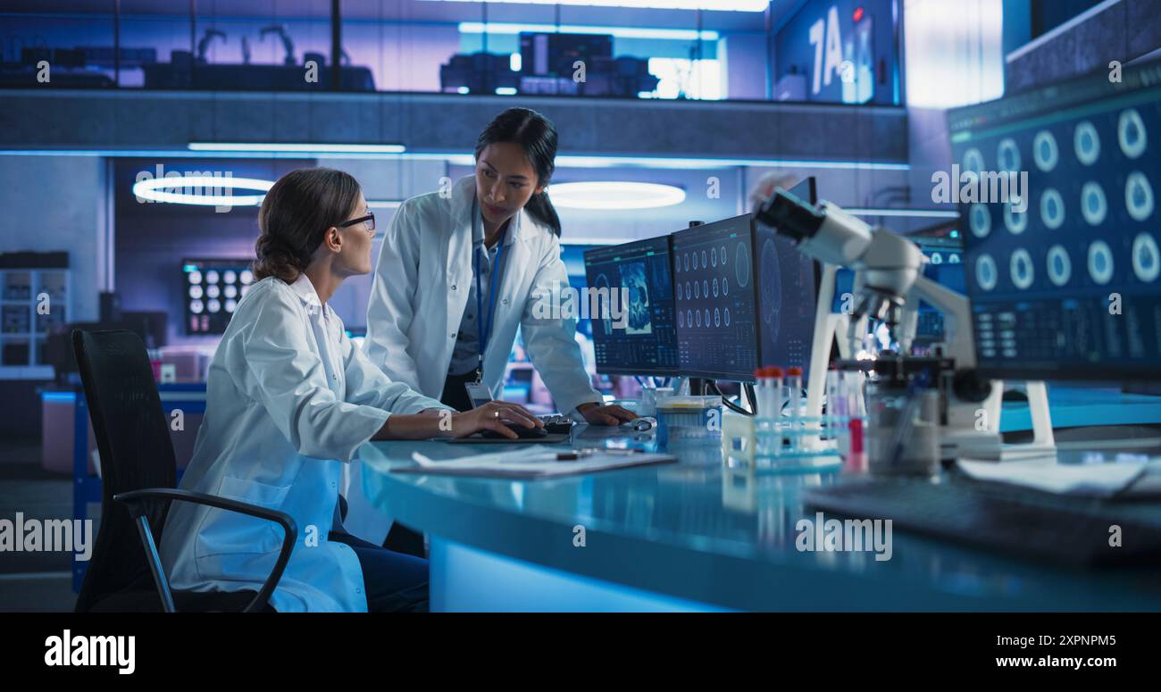 Asian And Caucasian Female Doctors Talking In Medical Research Center ...