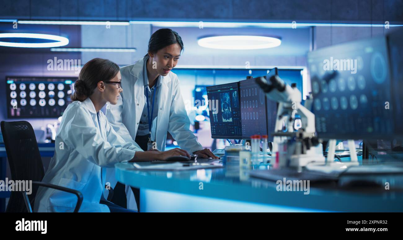 Asian And Caucasian Female Doctors Talking In Medical Research Center ...