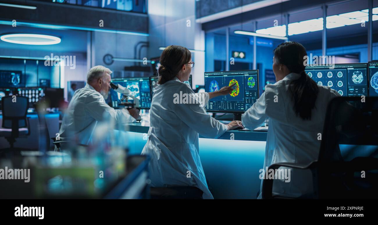 Back View Of Diverse Scientists Working In Medical Research Center ...