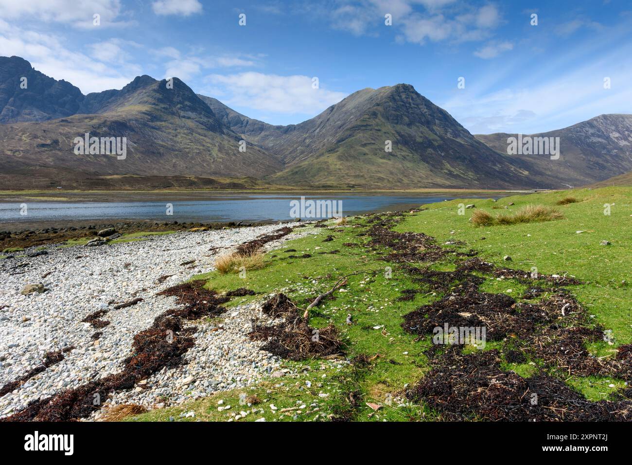 The peaks of Clach Glas, Garbh Bheinn, and Belig over Loch Slapin, near ...