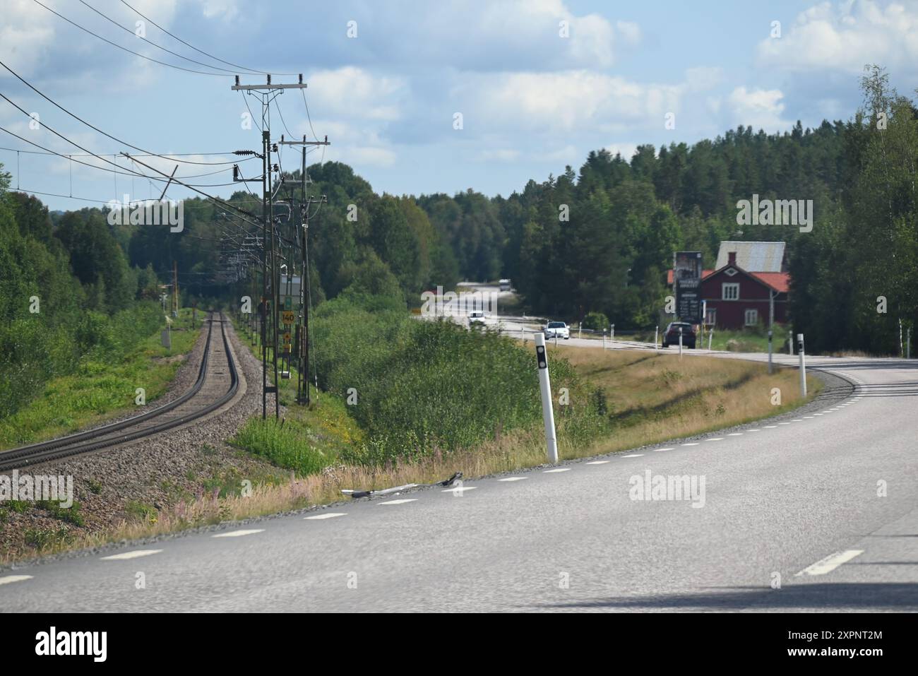 Railway curve next to road curve Stock Photo - Alamy