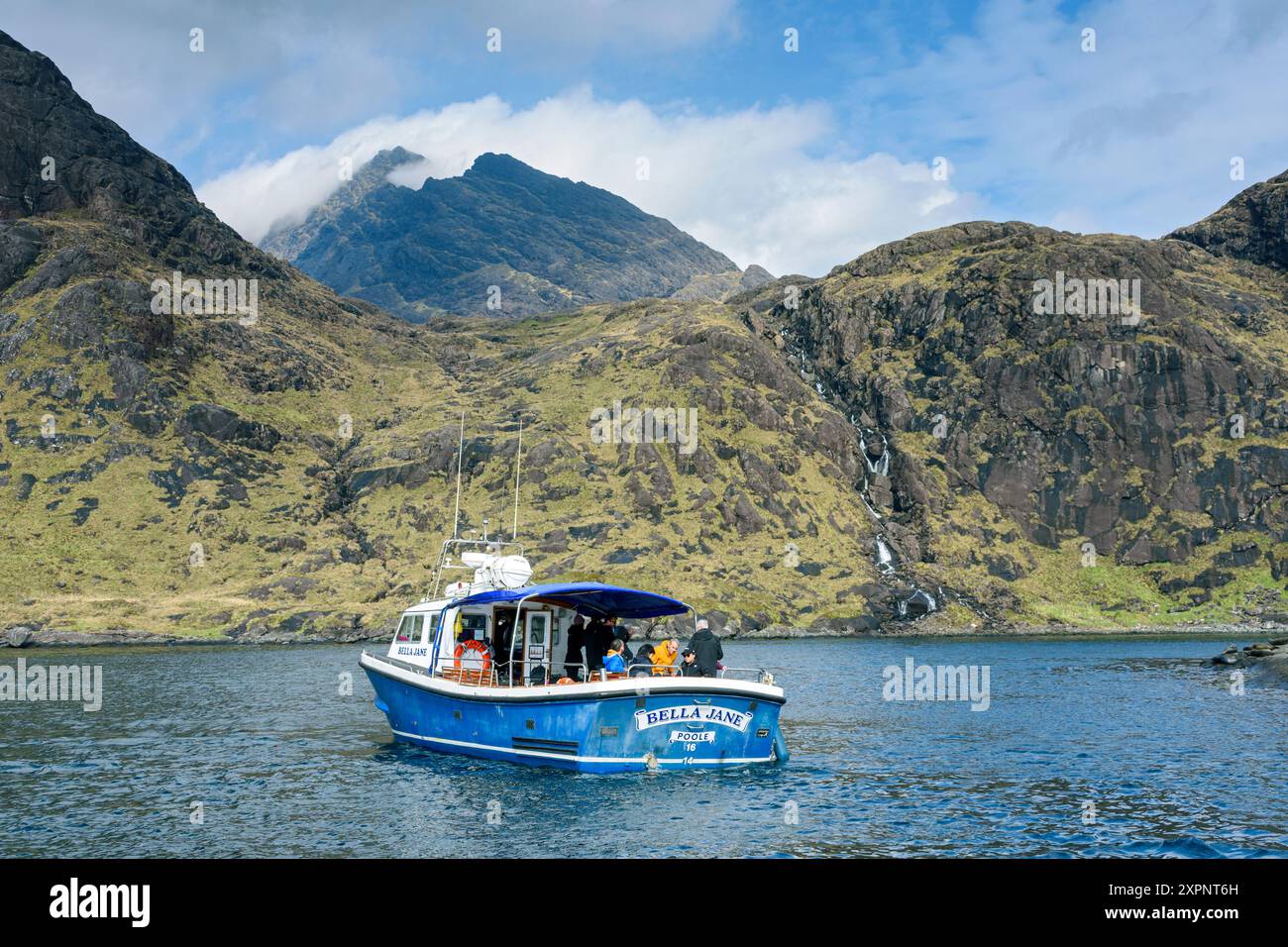 A tourist boat on Loch na Cuilce, an inlet of Loch Scavaig, with the ...