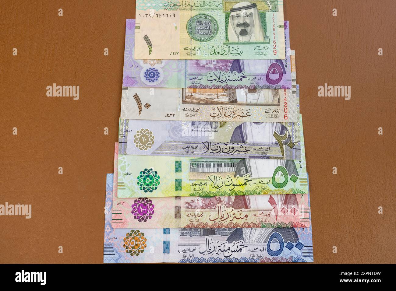 Saudi Arabian Banknotes Assortment on a leather surface background ...