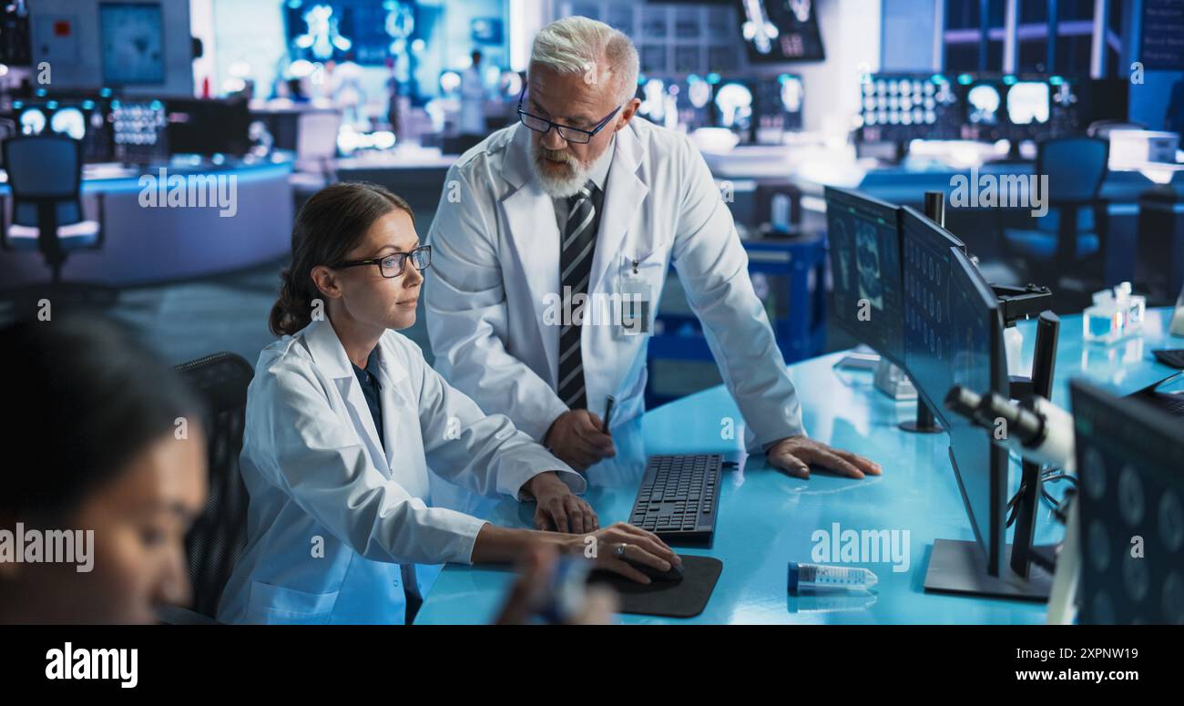 Biotechnology Research Laboratory: Two Caucasian Doctors Discussing CT ...