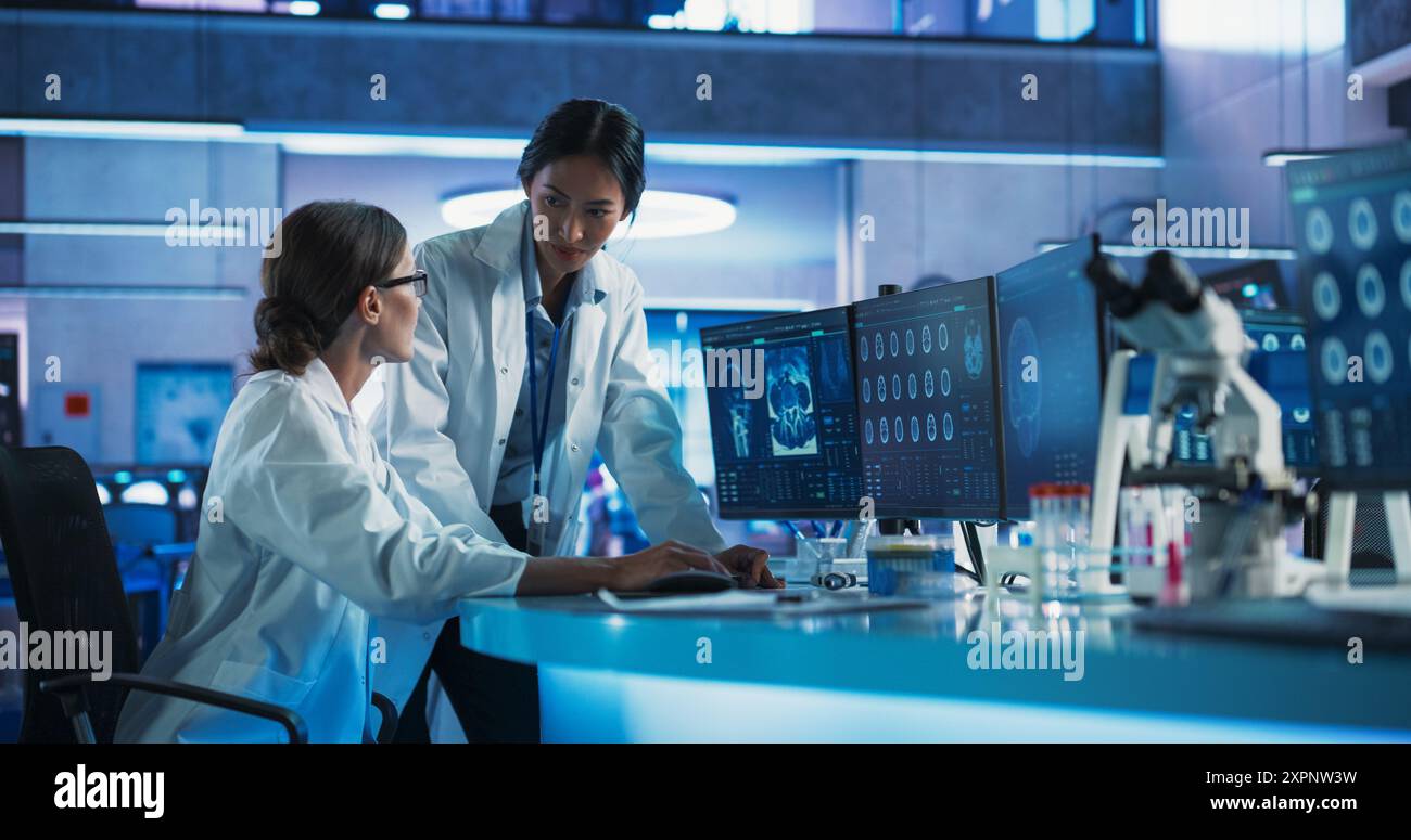 Asian And Caucasian Female Doctors Talking In Medical Research Center ...