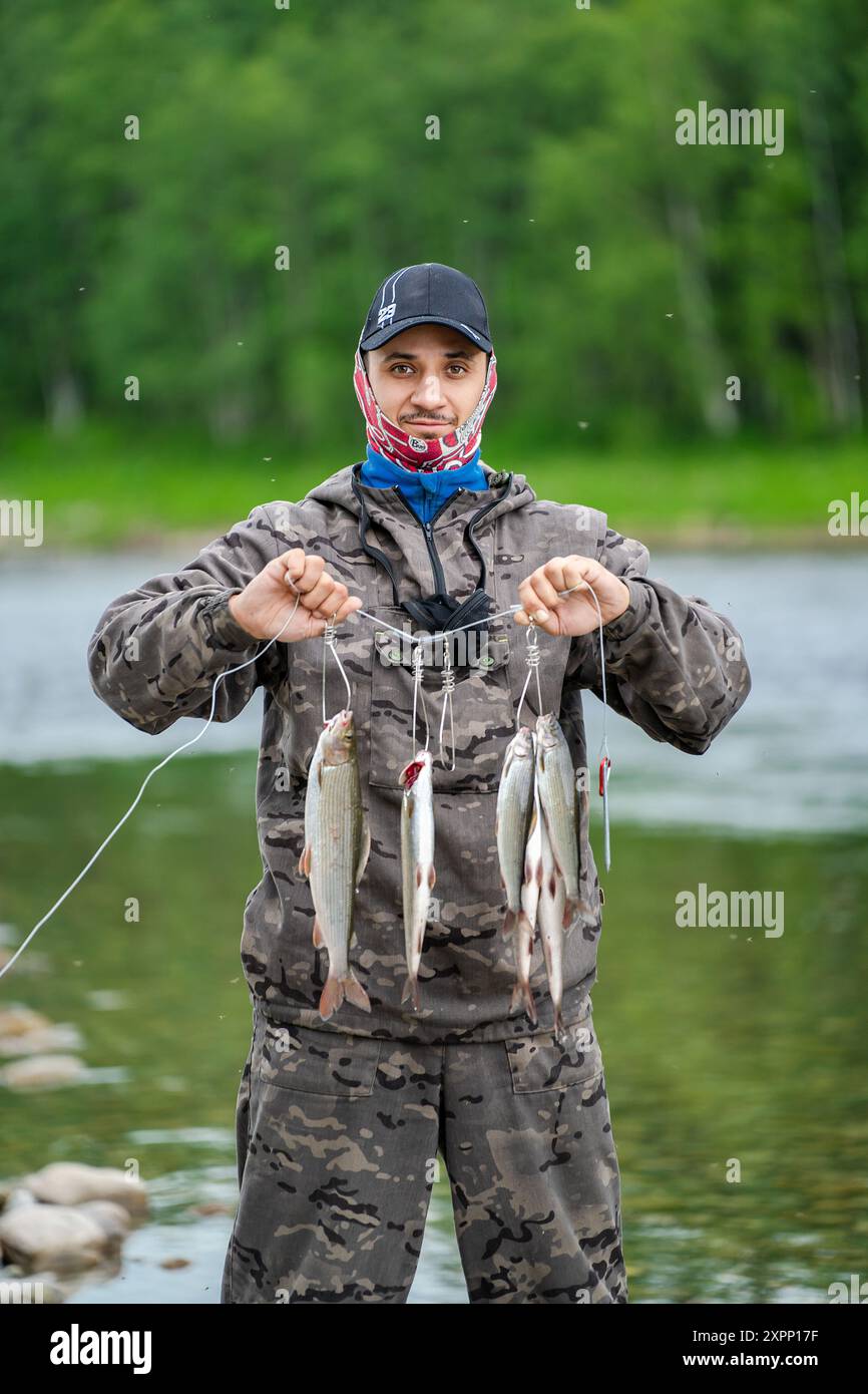 Fisherman shows catch in hi-res stock photography and images - Alamy