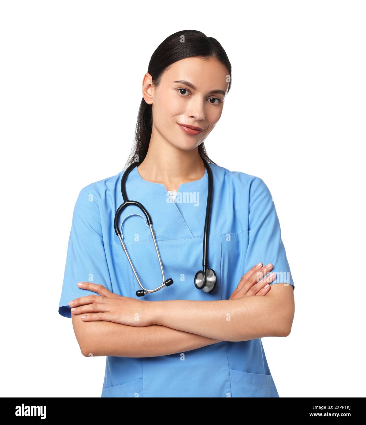 Beautiful nurse with crossed arms on white background Stock Photo - Alamy