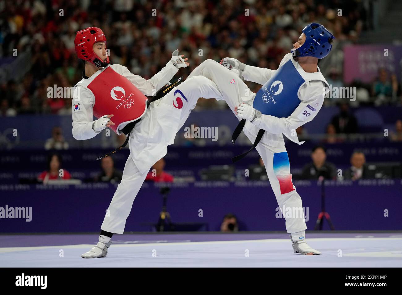 France's Cyrian Ravet competes with South Korea's Park Tae-joon in a ...