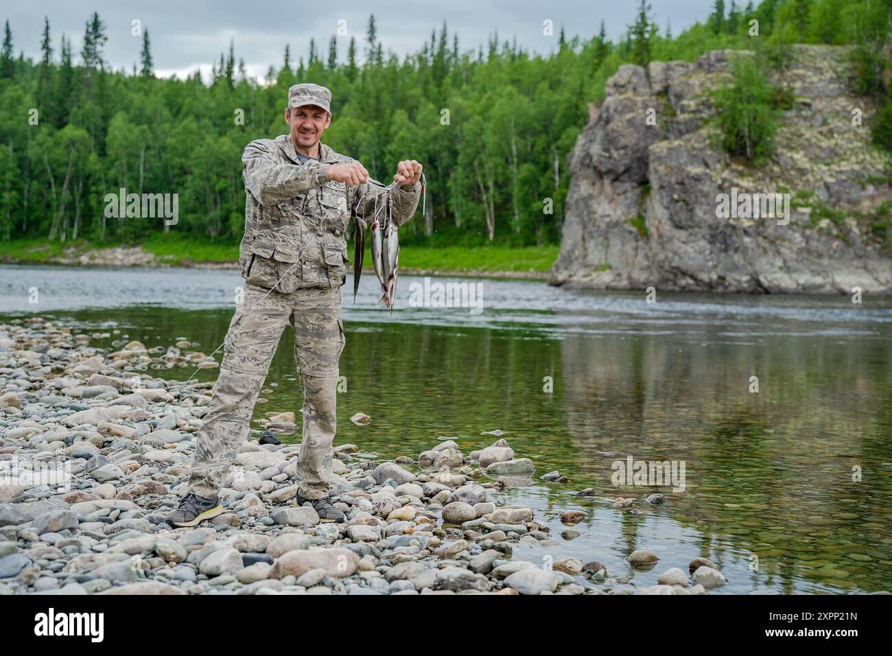 Fisherman shows catch in hi-res stock photography and images - Alamy