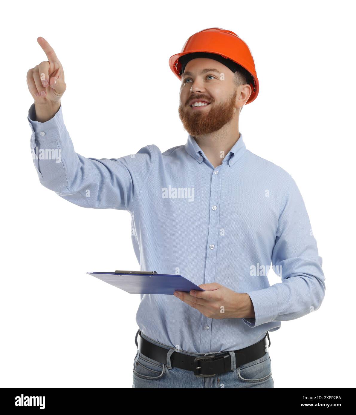 Engineer in hard hat with clipboard pointing at something on white ...