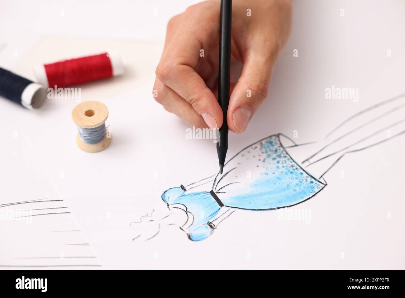 Fashion designer drawing sketch of dress at table, closeup Stock Photo ...