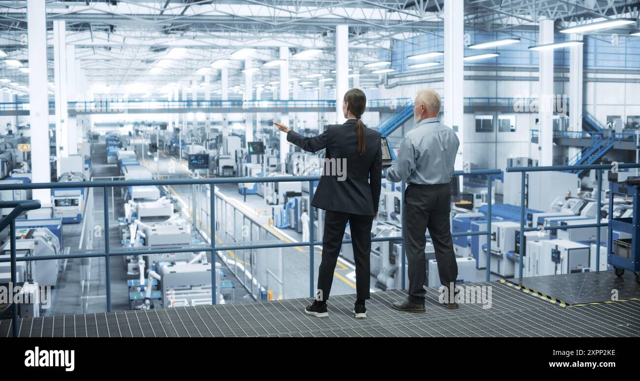 Male Engineer and Female Project Manager Standing on a Platform ...