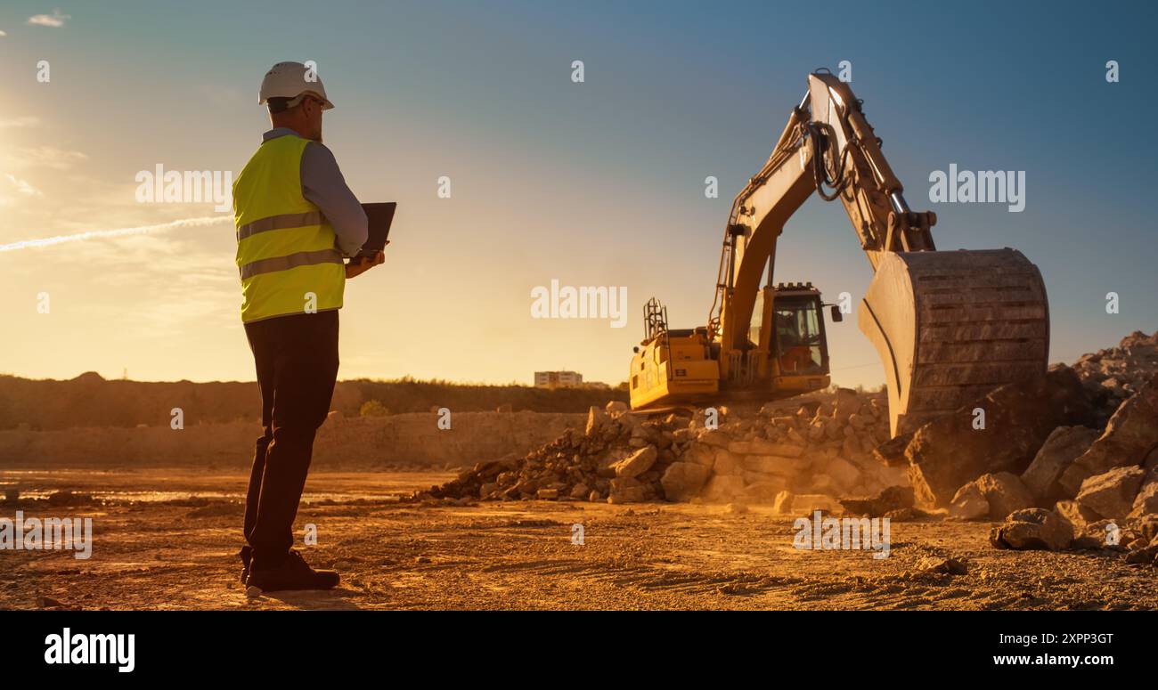 Caucasian Male Civil Engineer Using Laptop Computer On Construction ...