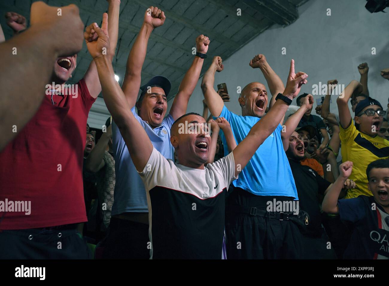 Supporters and relatives celebrate after watching Algerian boxer Imane ...