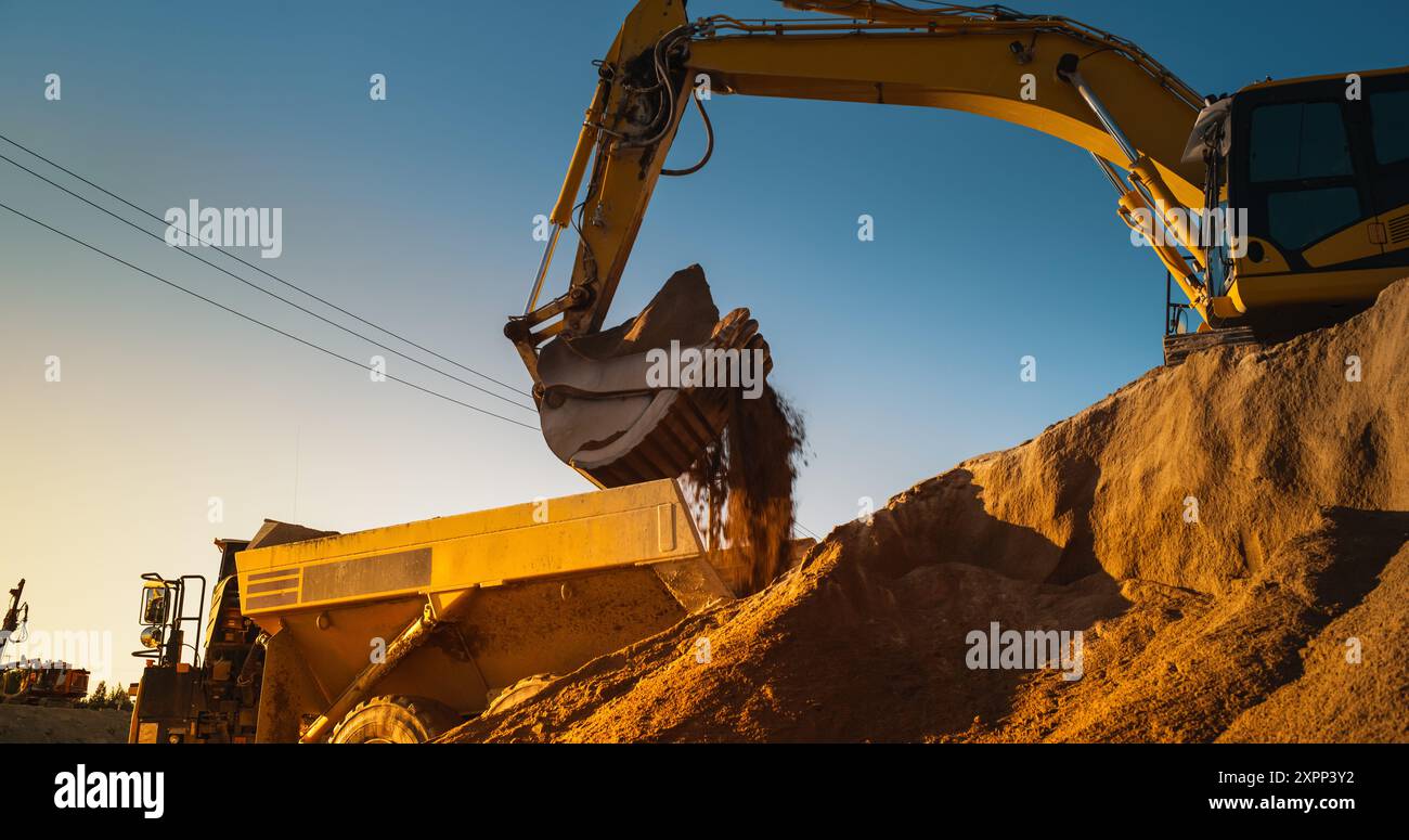 Construction Site On Sunny Evening: Industrial Excavator Loading Sand ...