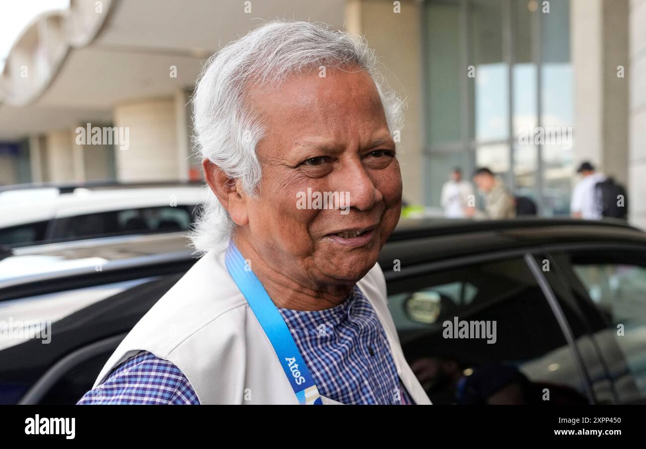 Nobel laureate Muhammad Yunus smiles upon his arrival at Charles de ...