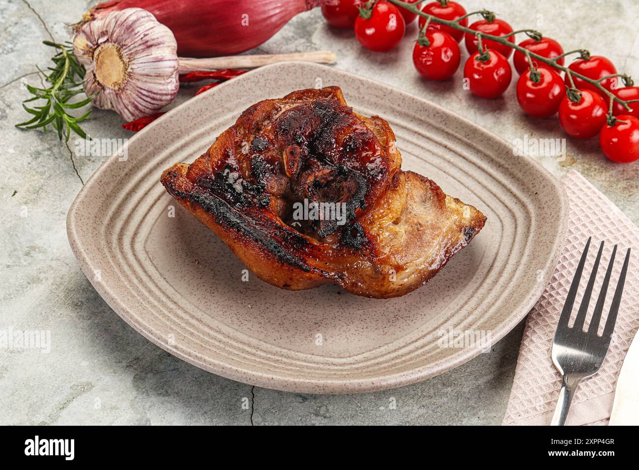 Roasted pork knuckle steak with bone Stock Photo - Alamy