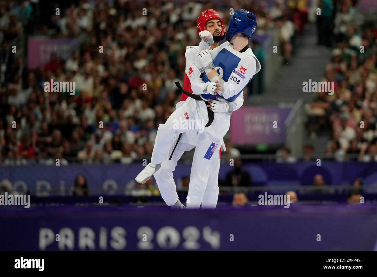Australia's Bailey Lewis competes with Tunisia's Mohamed Khalil ...