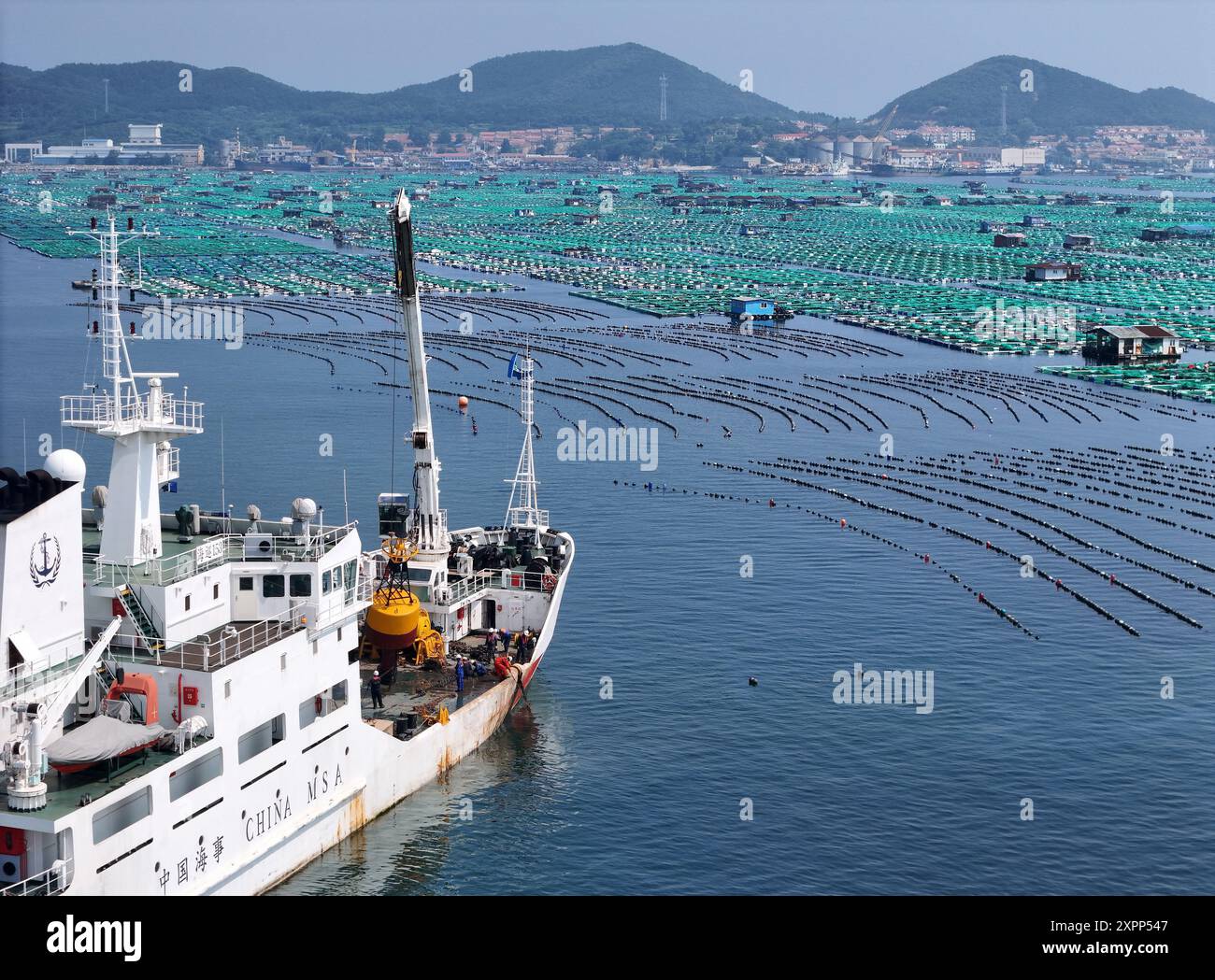 YANTAI, CHINA - AUGUST 7, 2024 - The "Coast guard153" navigation vessel ...