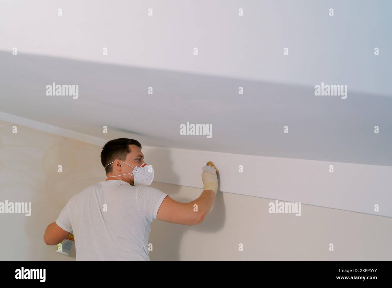 Disinfector washes the walls under the ceiling with a sponge Stock ...