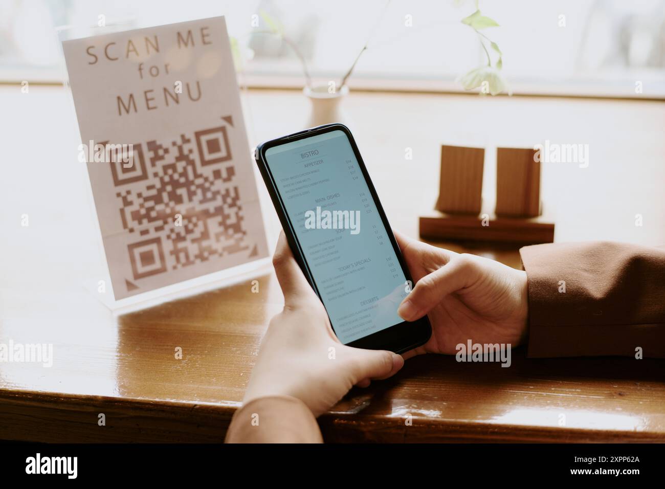 Scanning Menu QR Code in Restaurant with Smartphone Stock Photo - Alamy