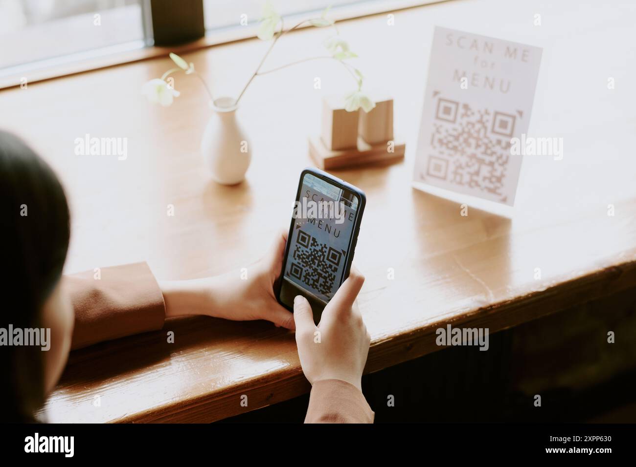 Scanning QR Code Menu in Coffee Shop Stock Photo - Alamy