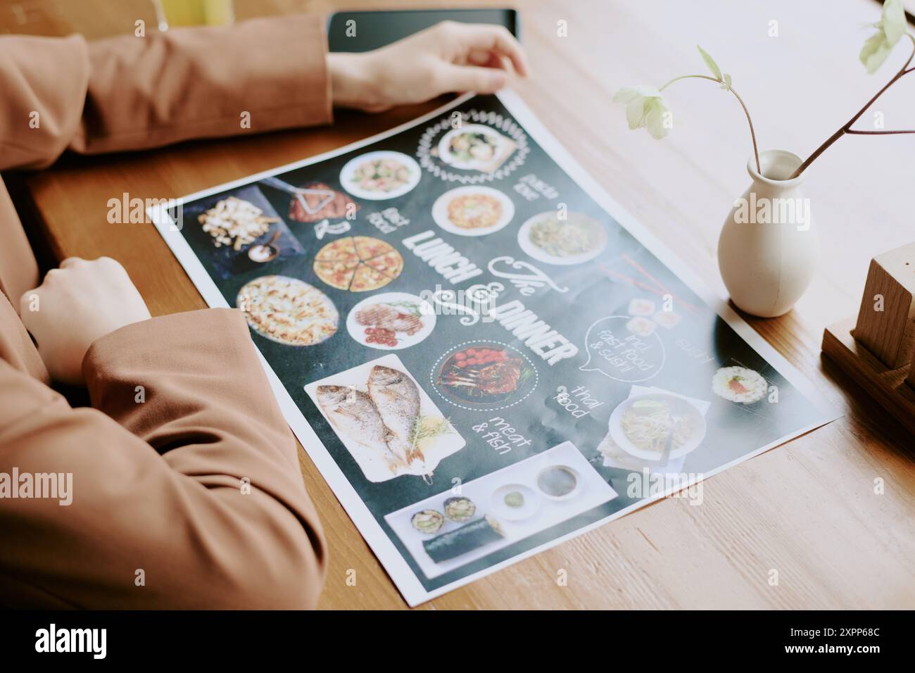 Reviewing Restaurant Menu with Delicious Dishes Displayed Stock Photo ...