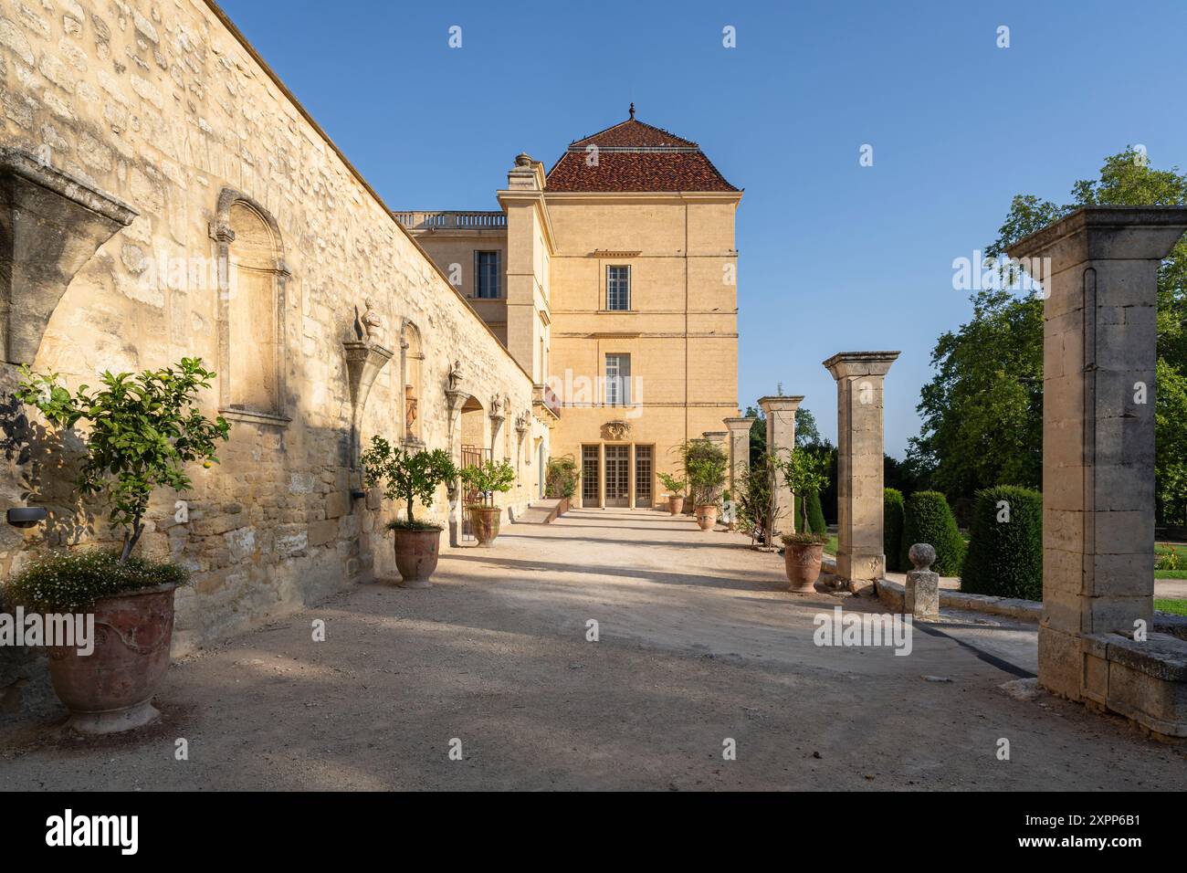 Exterior view of alley to the orangery of historic castle or chateau of ...