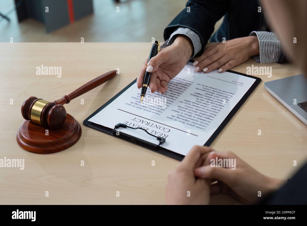 Professional Lawyer Discussing Contract Details with Client in Modern ...