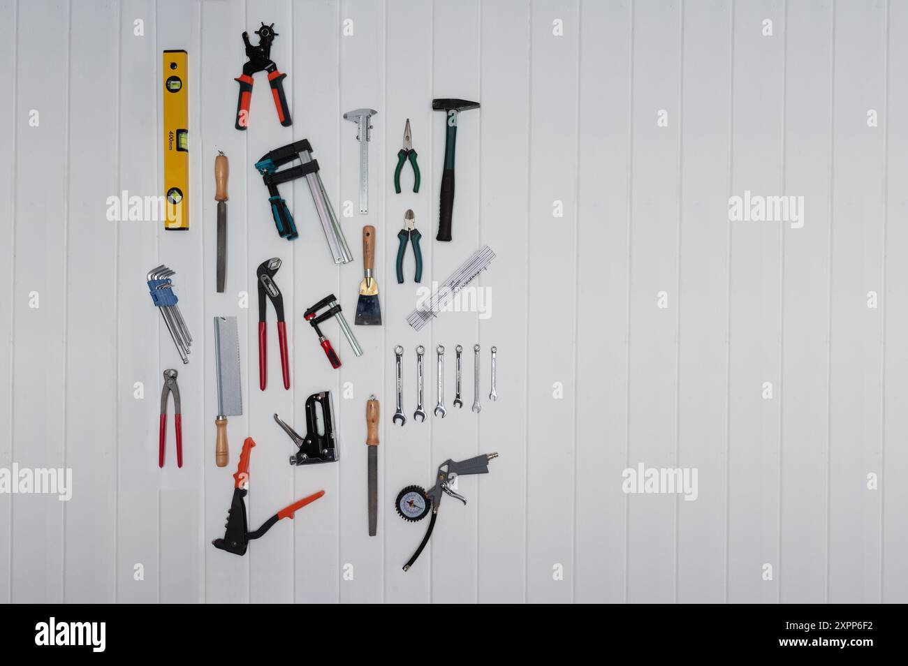 tools on the wall like hammer, pliers, saw, file Stock Photo - Alamy