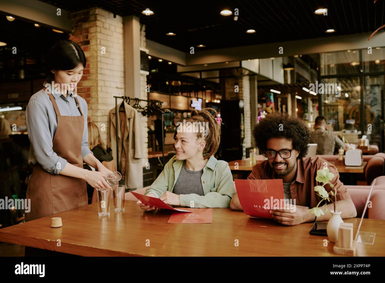 Restaurant waitress customers smile hi-res stock photography and images ...