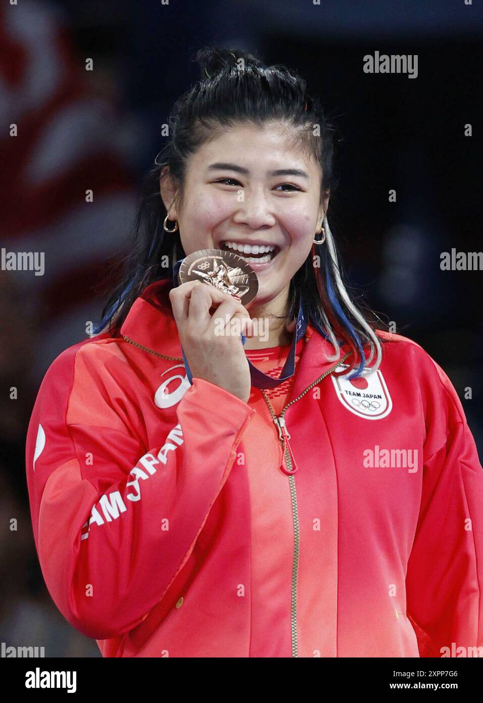 Nonoka Ozaki of Japan poses with her bronze medal she won in the wrestling women's freestyle 68 ...