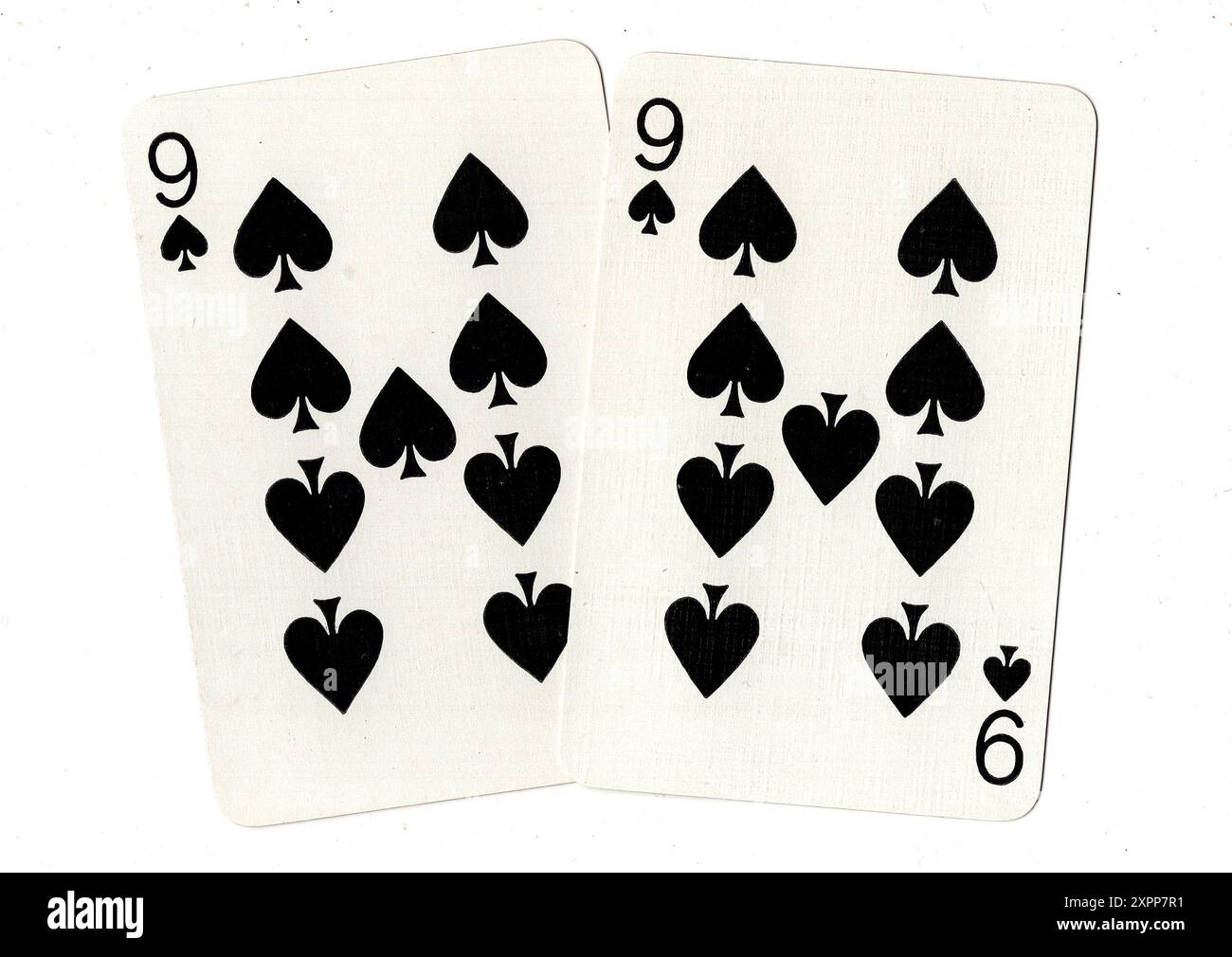 A pair of vintage nine of spades playing cards on a white background ...