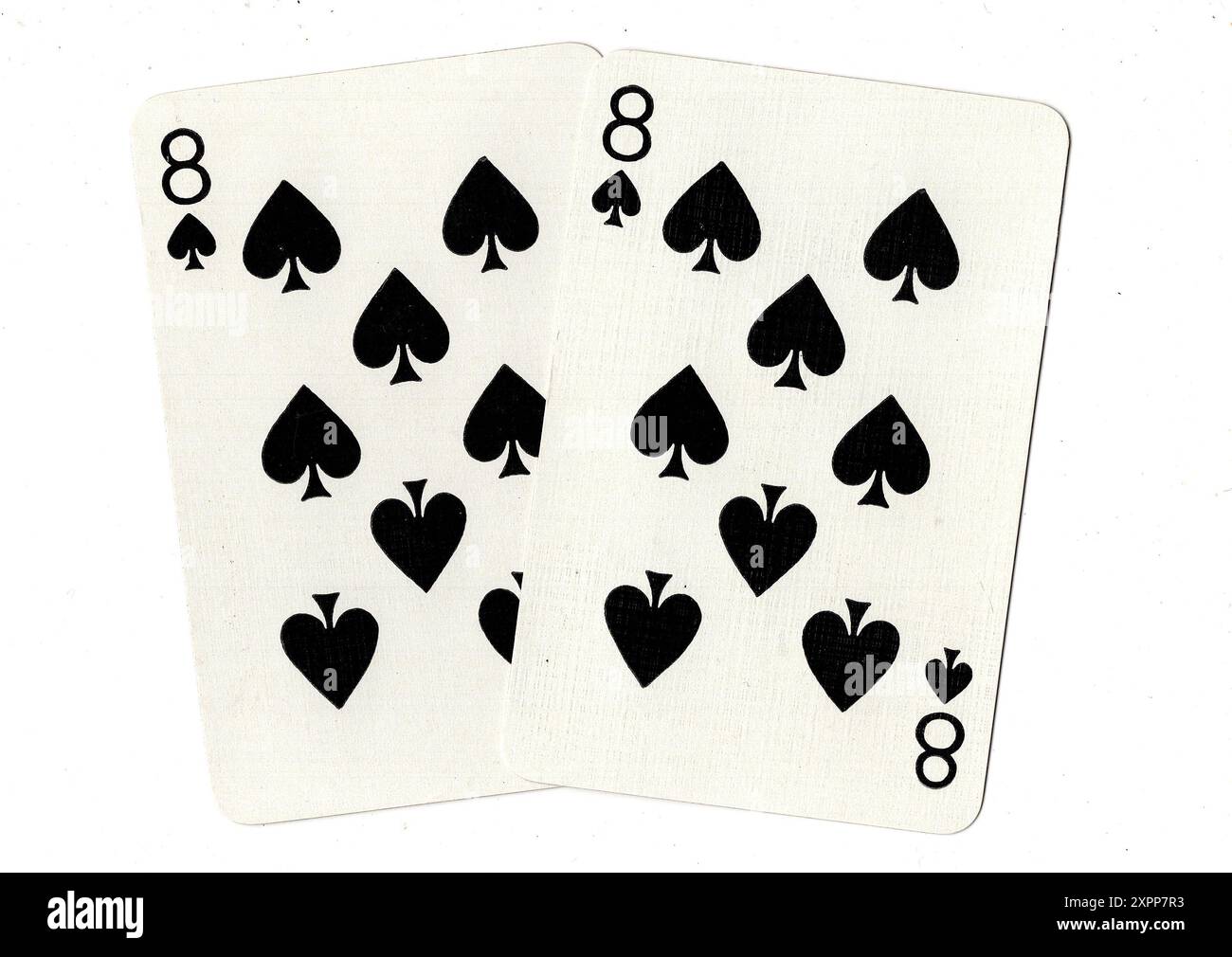 A pair of vintage eight of spades playing cards on a white background ...