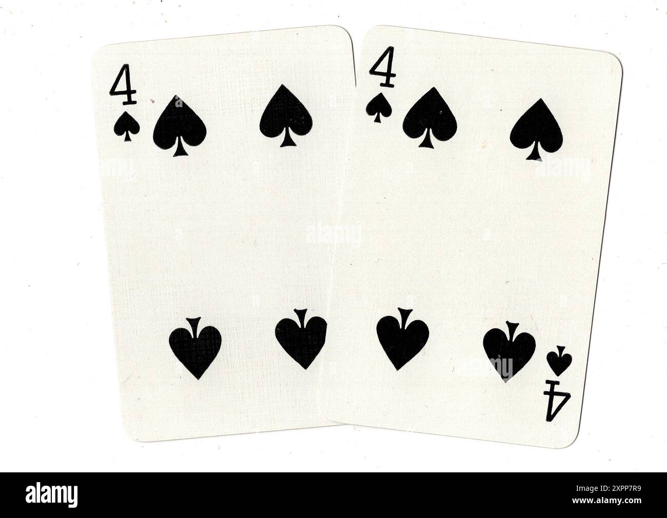 A pair of vintage four of spades playing cards on a white background ...